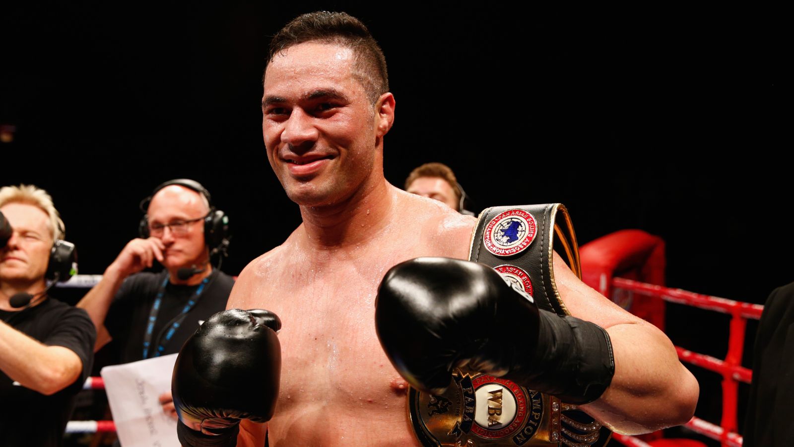 Joseph Parker shows off a key punch as Va'aiga Tuigamala looks on ...